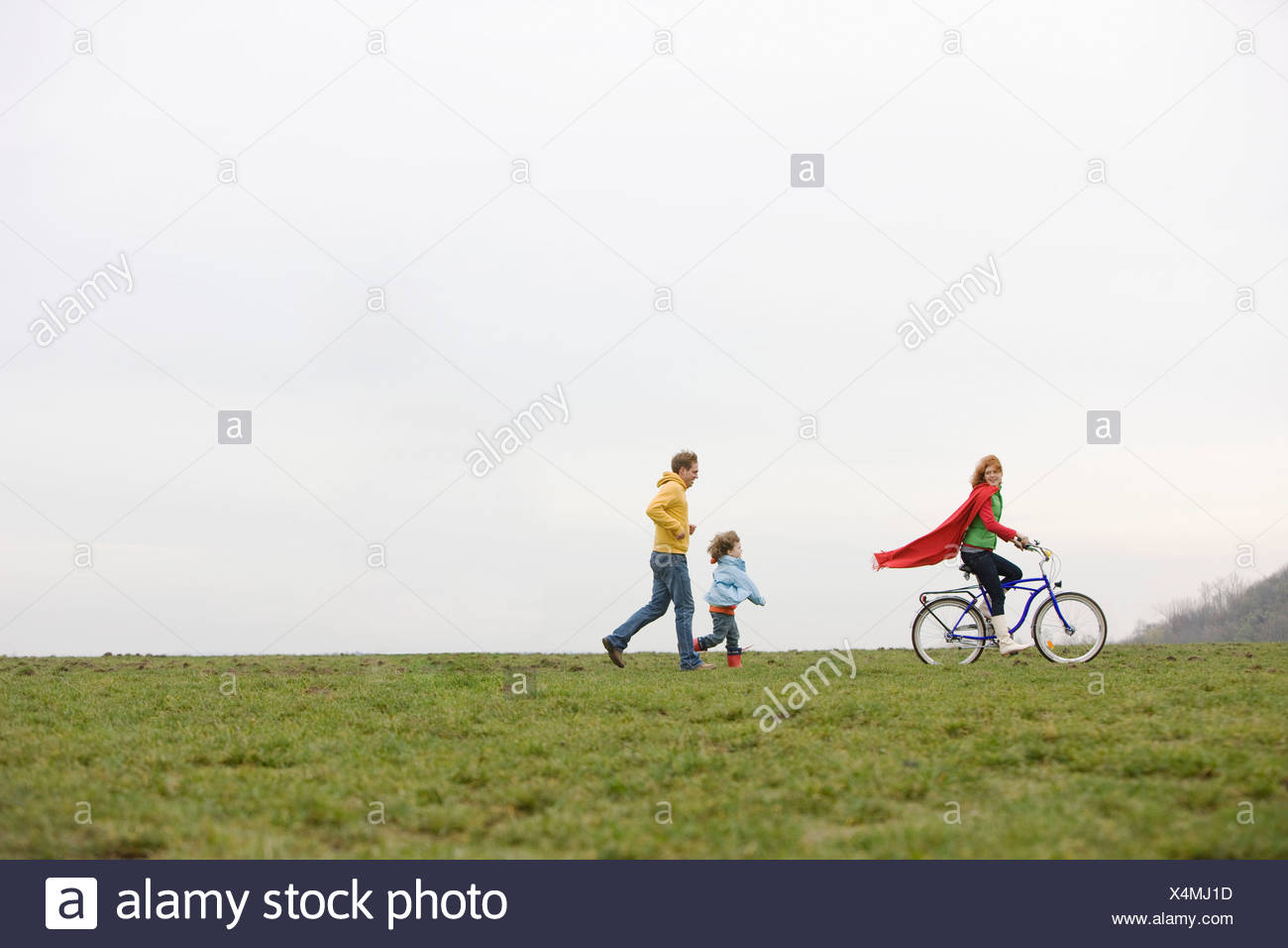 Man With His Son Riding A Bike Stock Photos & Man With His Son Riding A ...