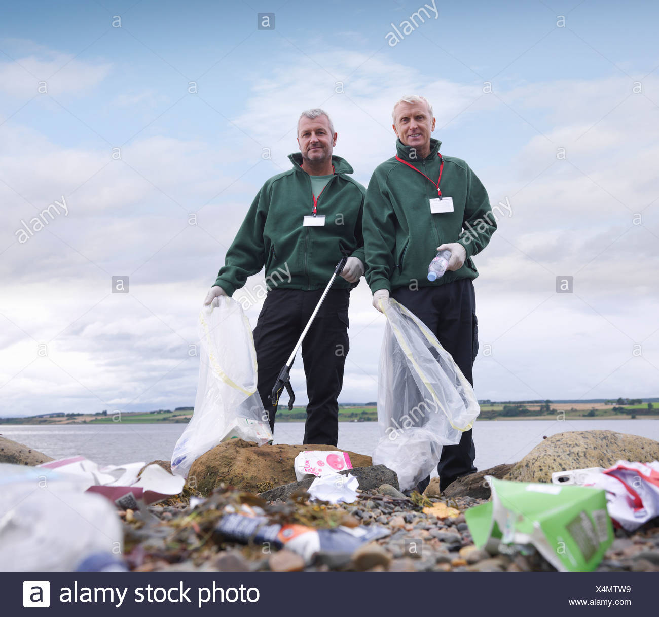 Cleaning Trash At Beach High Resolution Stock Photography and Images ...