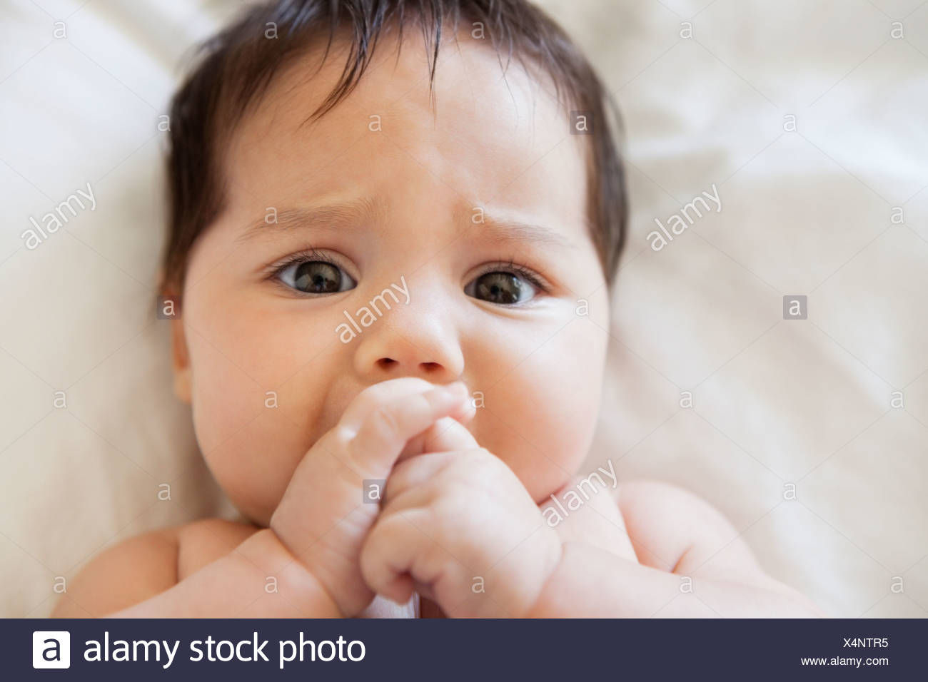 Baby Lying Down Sucking Thumb High Resolution Stock Photography and ...