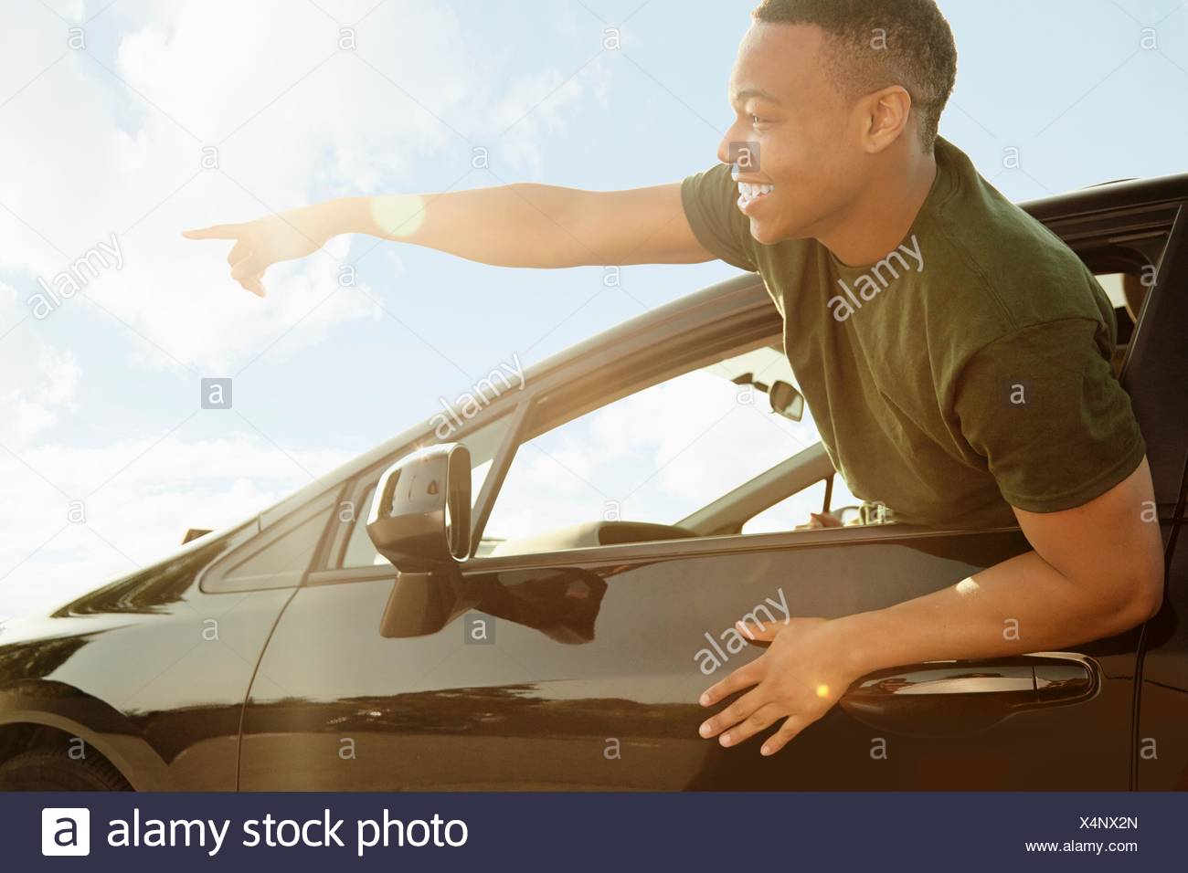 Man Leaning Out Of Car Window Stock Photos & Man Leaning Out Of Car ...