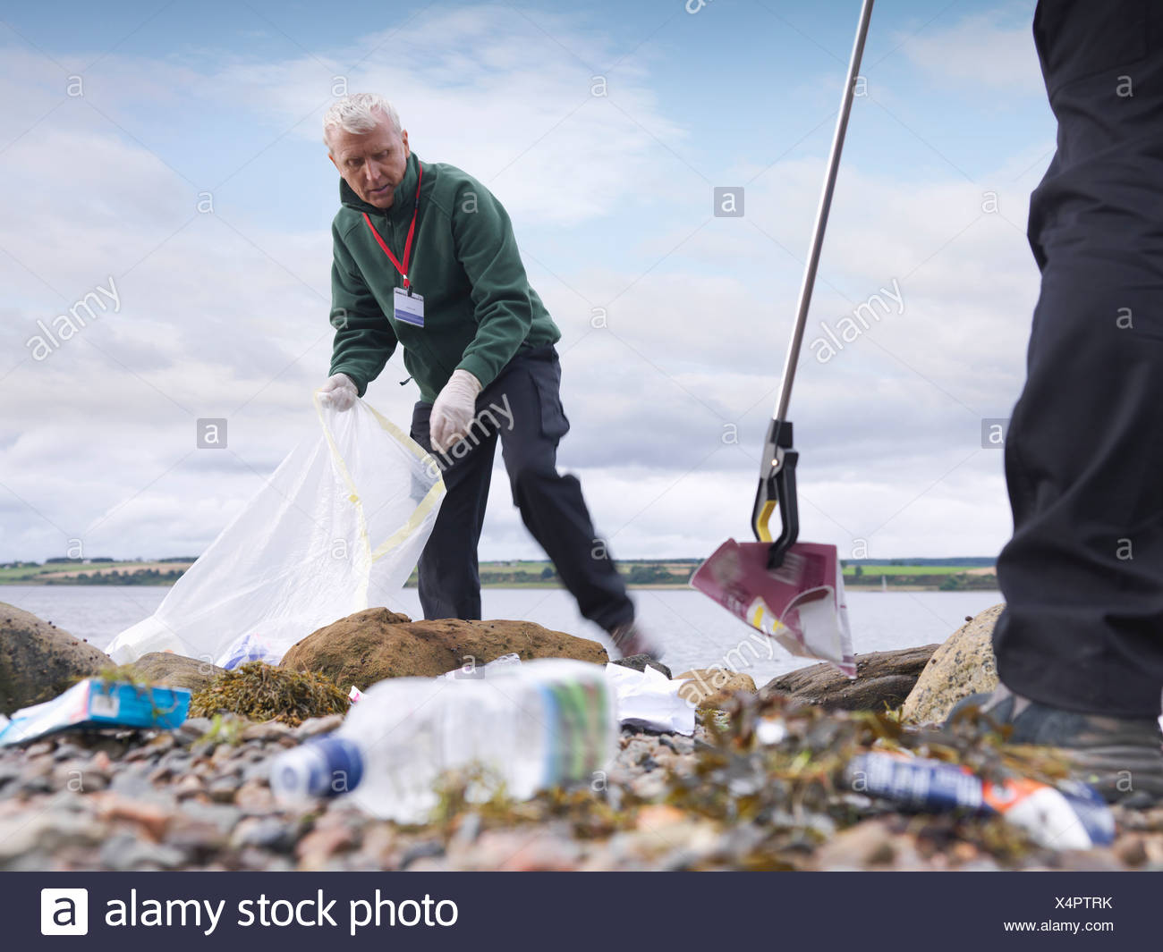 Cleaning Trash At Beach High Resolution Stock Photography and Images ...
