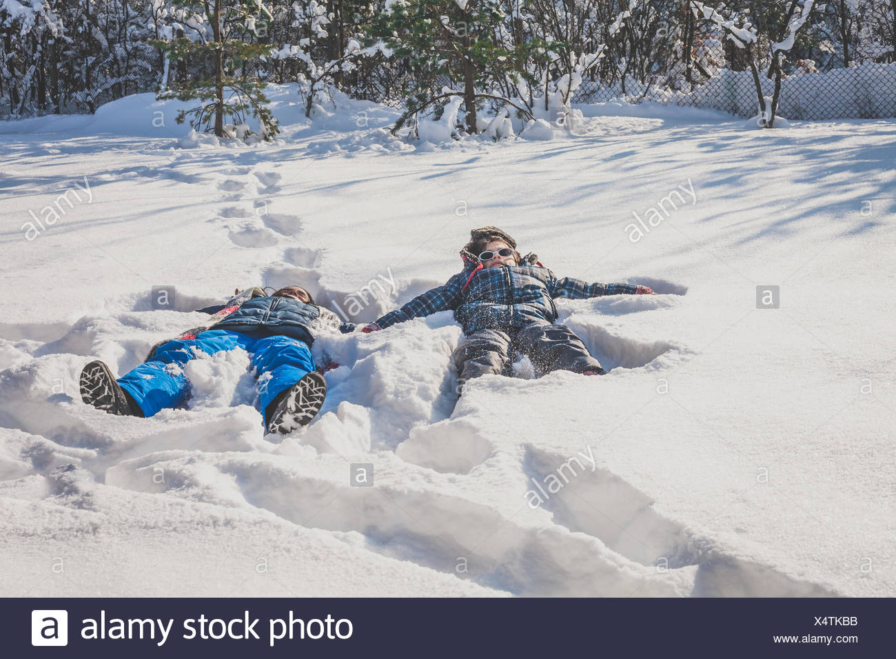 Children Making Snow Angels High Resolution Stock Photography and ...