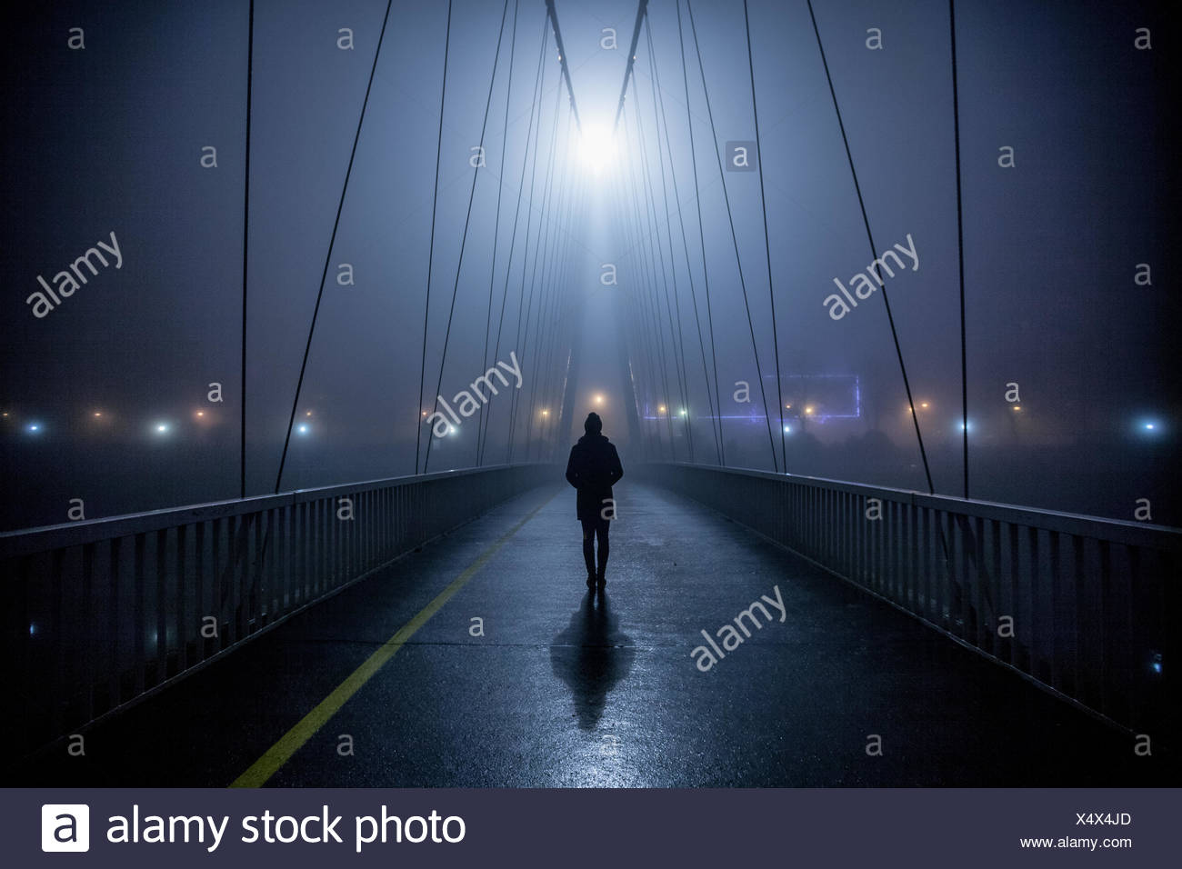 Lonely Woman Walking Over Bridge Stock Photos & Lonely Woman Walking ...