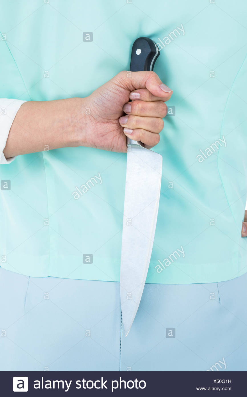 Knife Behind Back High Resolution Stock Photography and Images - Alamy