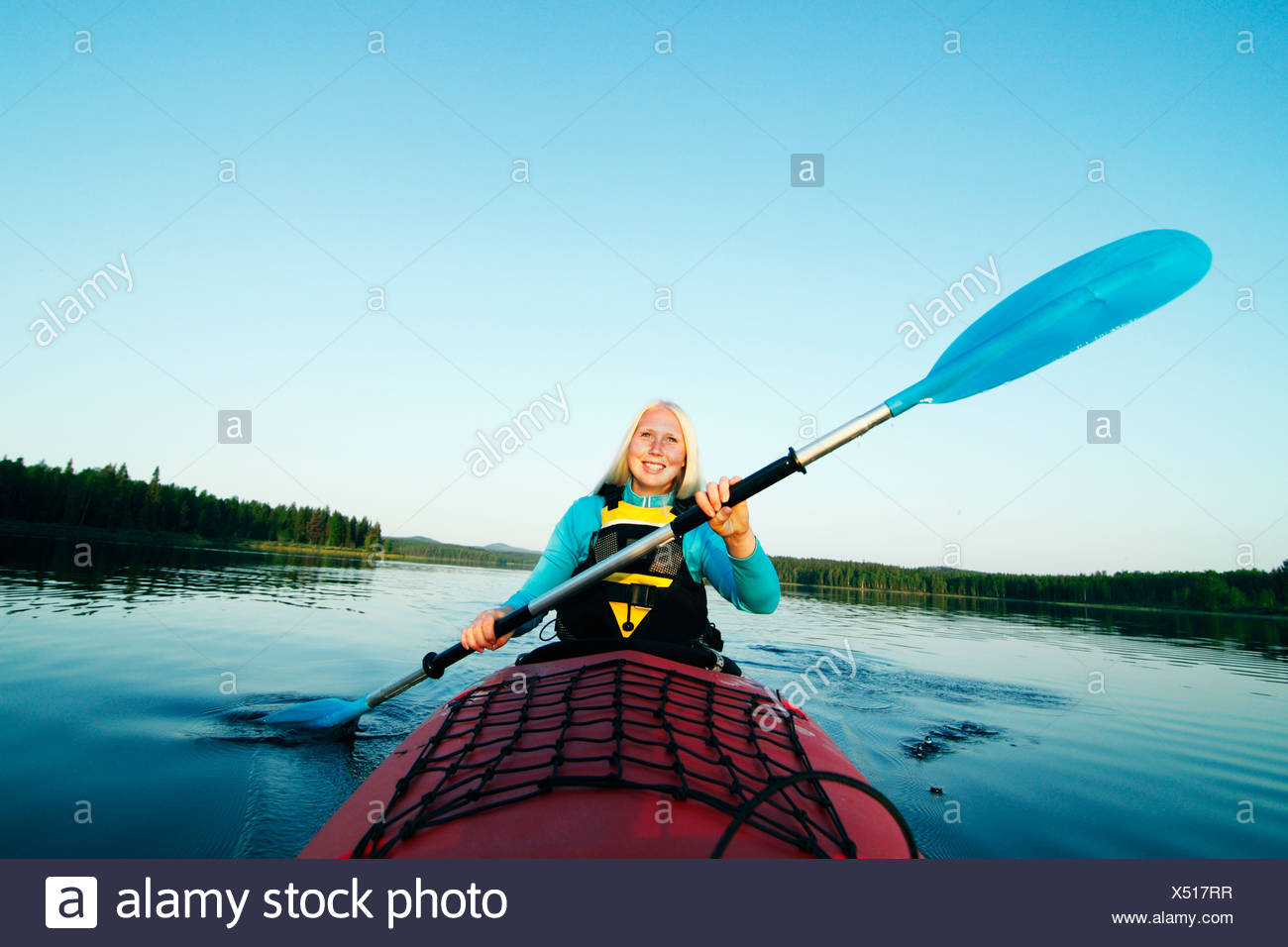 Smiling Woman Holding Paddle High Resolution Stock Photography and ...
