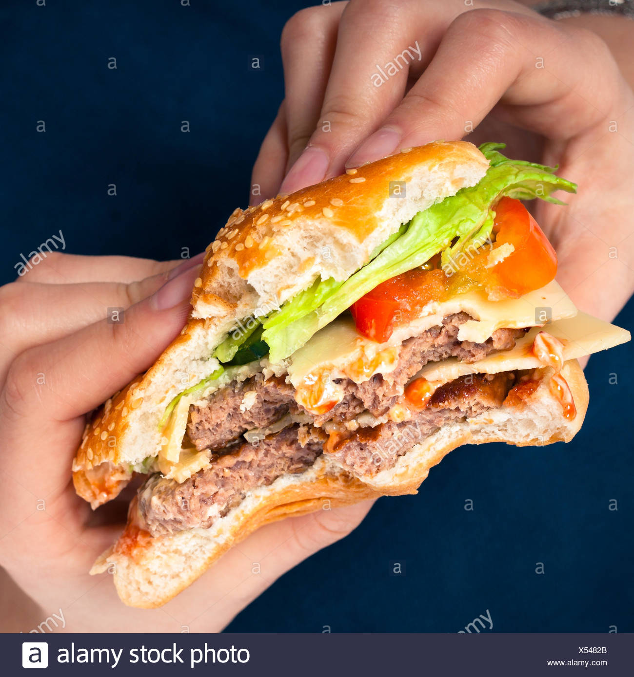 Woman Large Cheeseburger Stock Photos & Woman Large Cheeseburger Stock ...