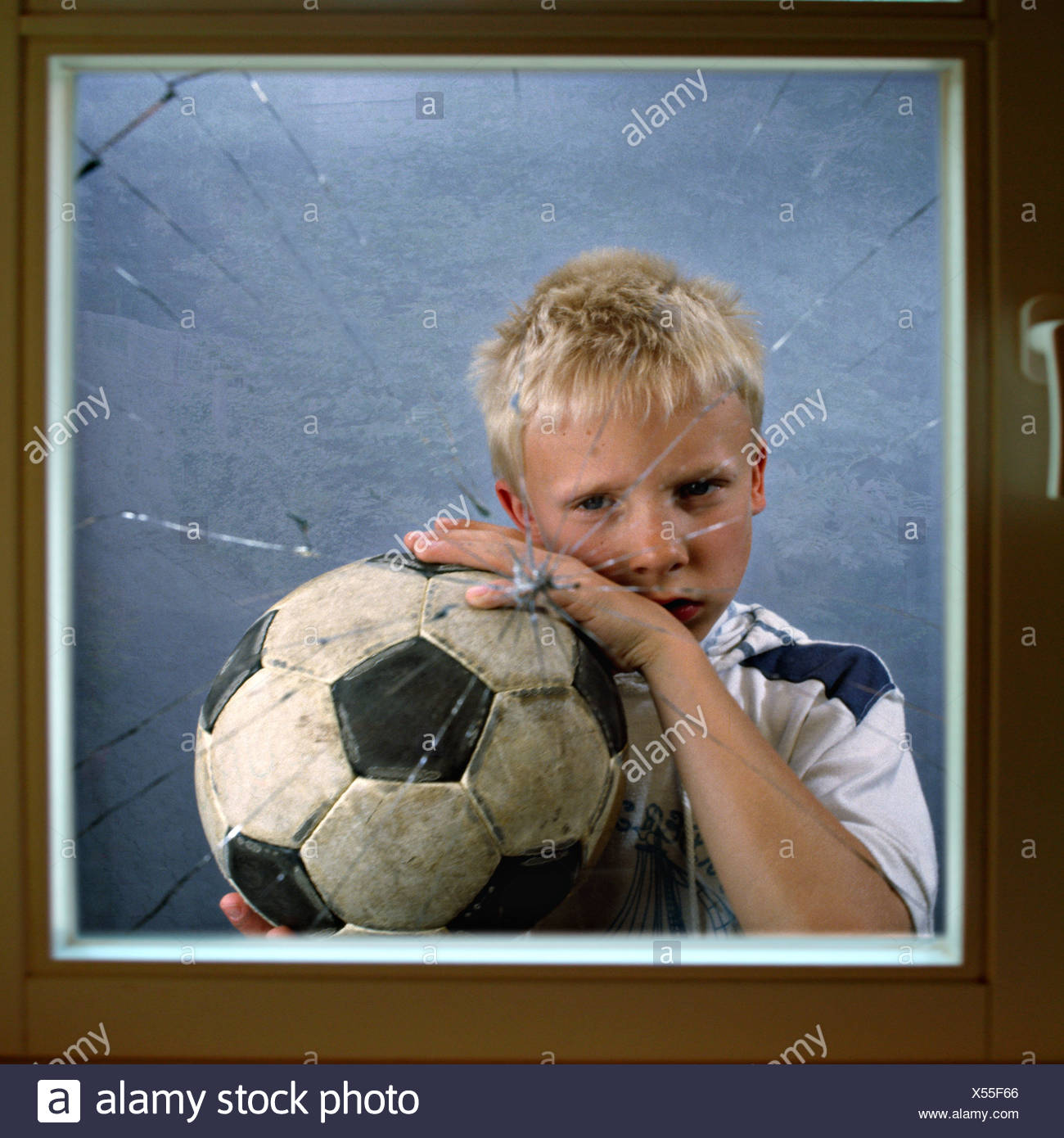 Boys Football Broken Window High Resolution Stock Photography and ...