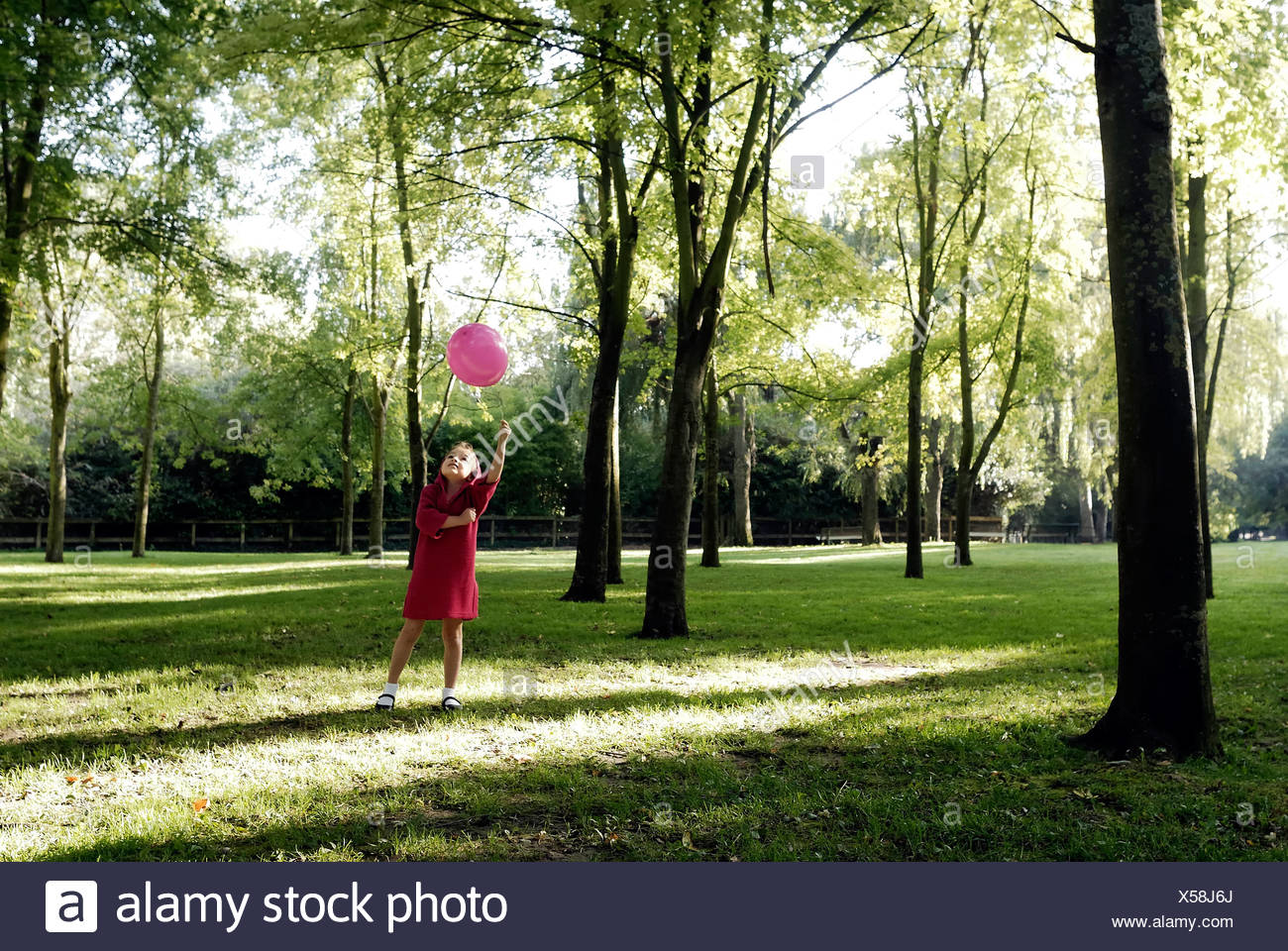 Girl Reaching Balloon High Resolution Stock Photography and Images - Alamy