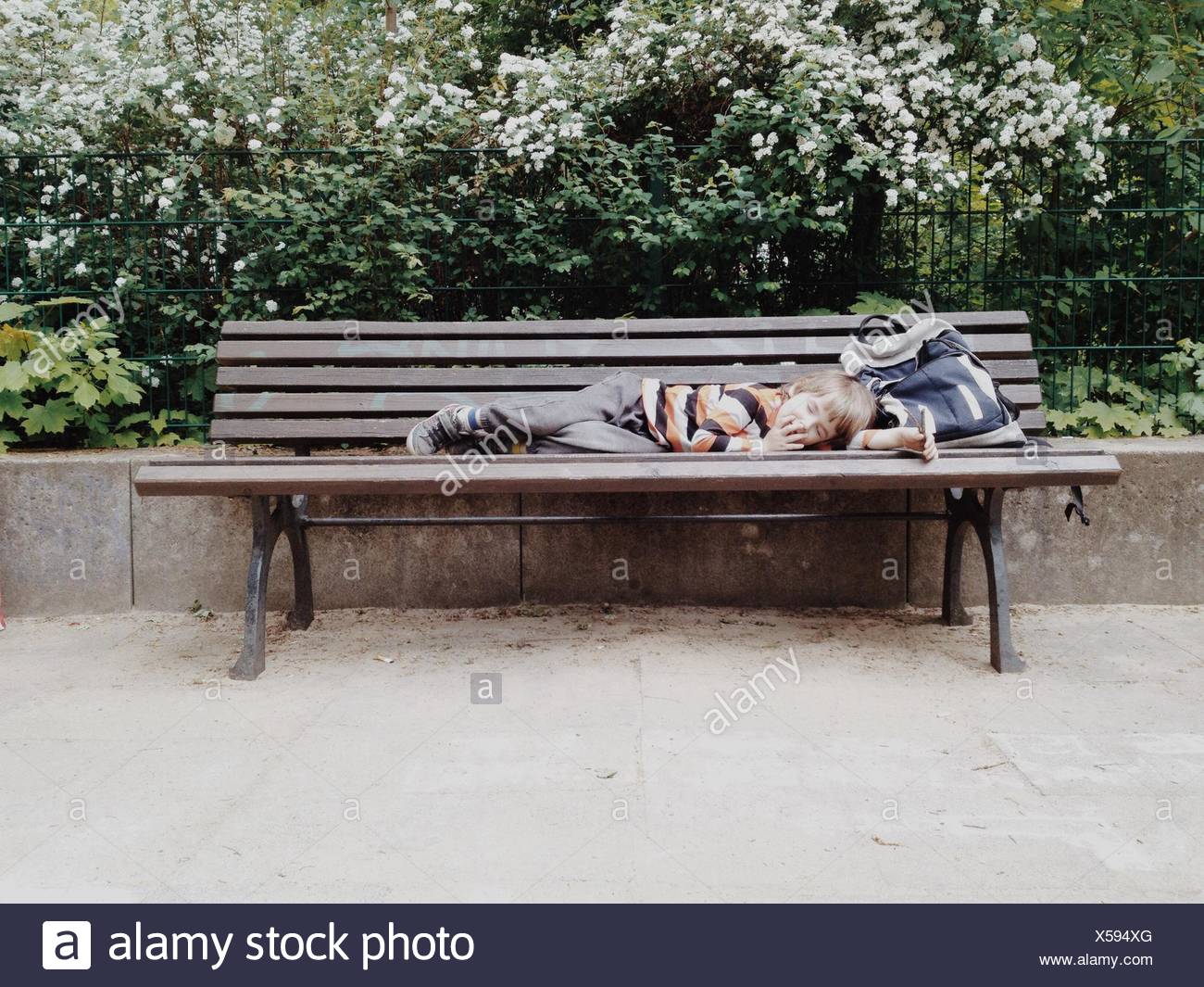 Boy Sleeping On Bench High Resolution Stock Photography and Images - Alamy