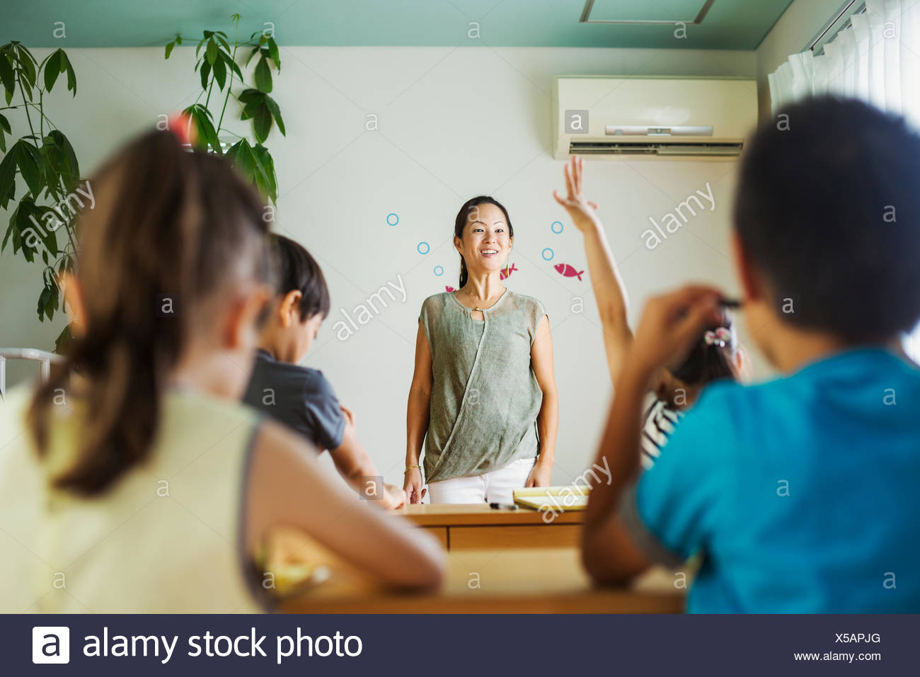 Female Teacher Classroom Desk High Resolution Stock Photography and ...