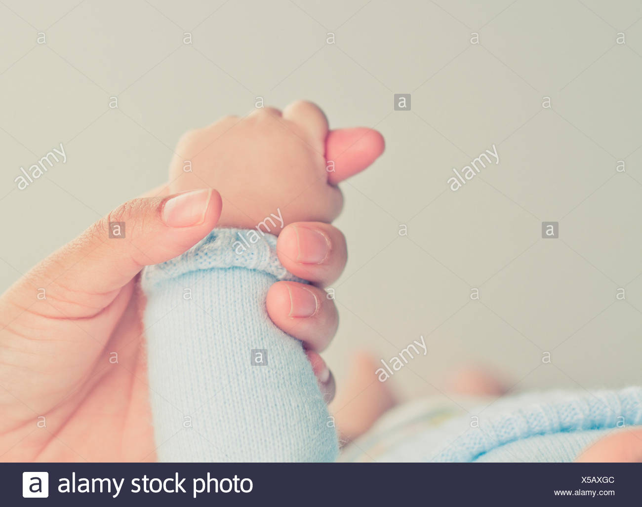 Baby Holding Hands Parent High Resolution Stock Photography and Images ...
