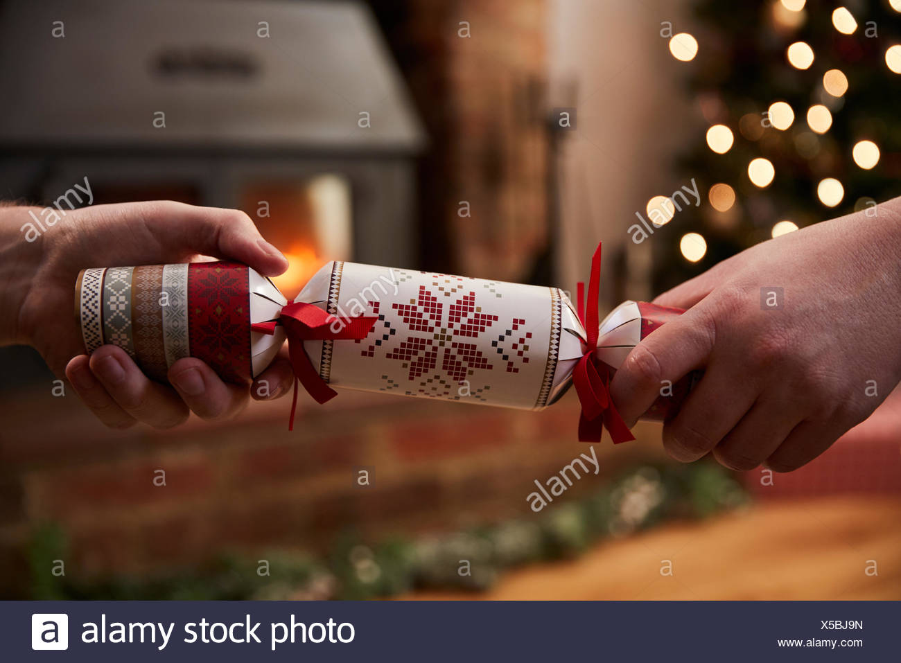 People Pulling Cracker Stock Photos & People Pulling Cracker Stock ...