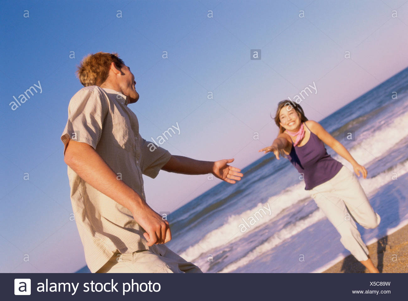 Two People Reaching Out For Each Other High Resolution Stock ...