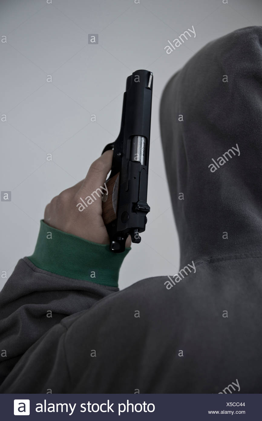 Man Holding Gun From Behind High Resolution Stock Photography and ...