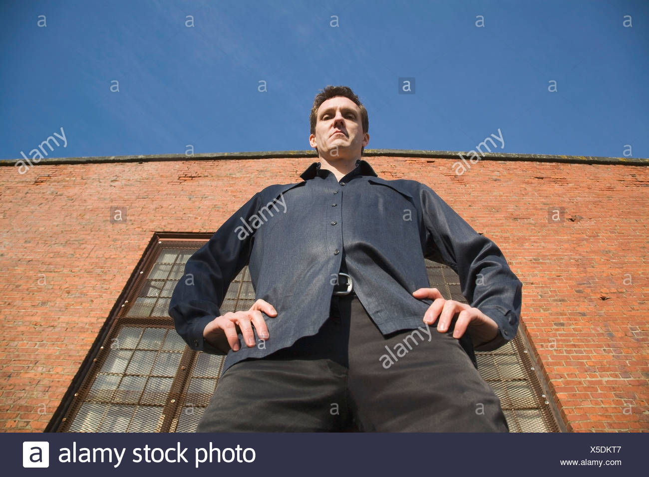 Proud Man Standing And Facing Camera High Resolution Stock Photography ...