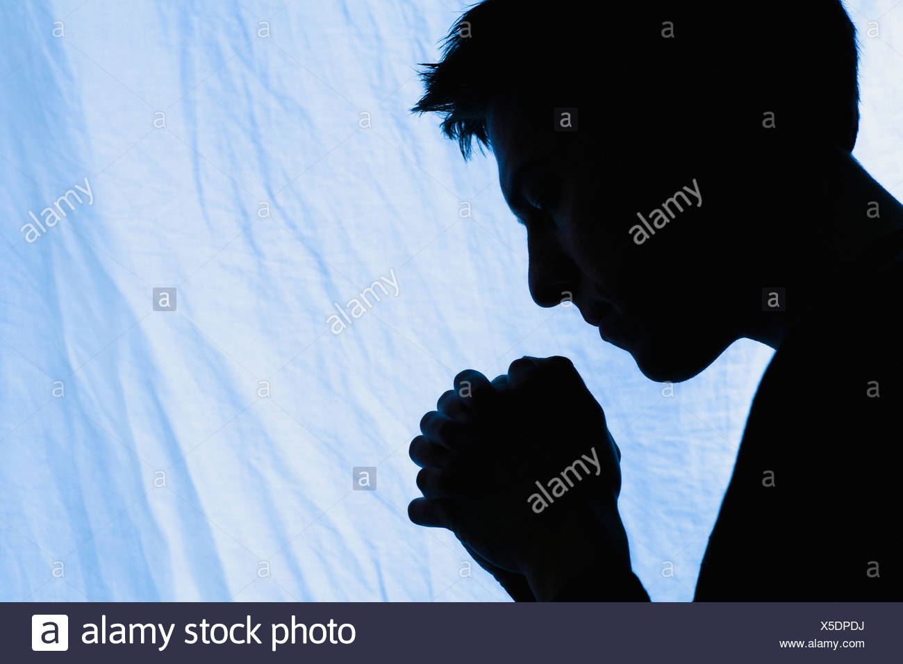 Head Bowed Prayer Stock Photos & Head Bowed Prayer Stock Images - Alamy