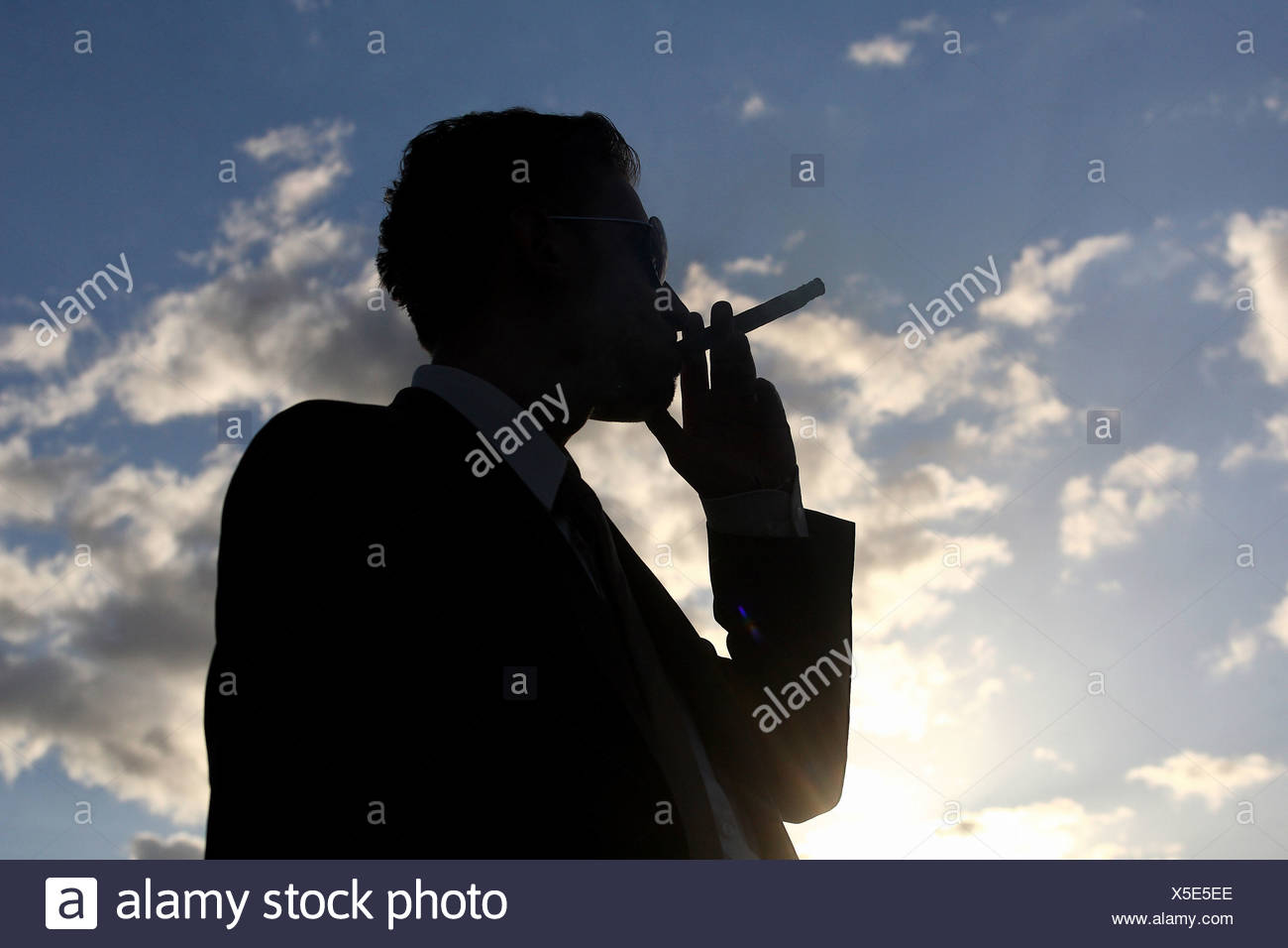 Man In Silhouette Smoking Cigar High Resolution Stock Photography and ...