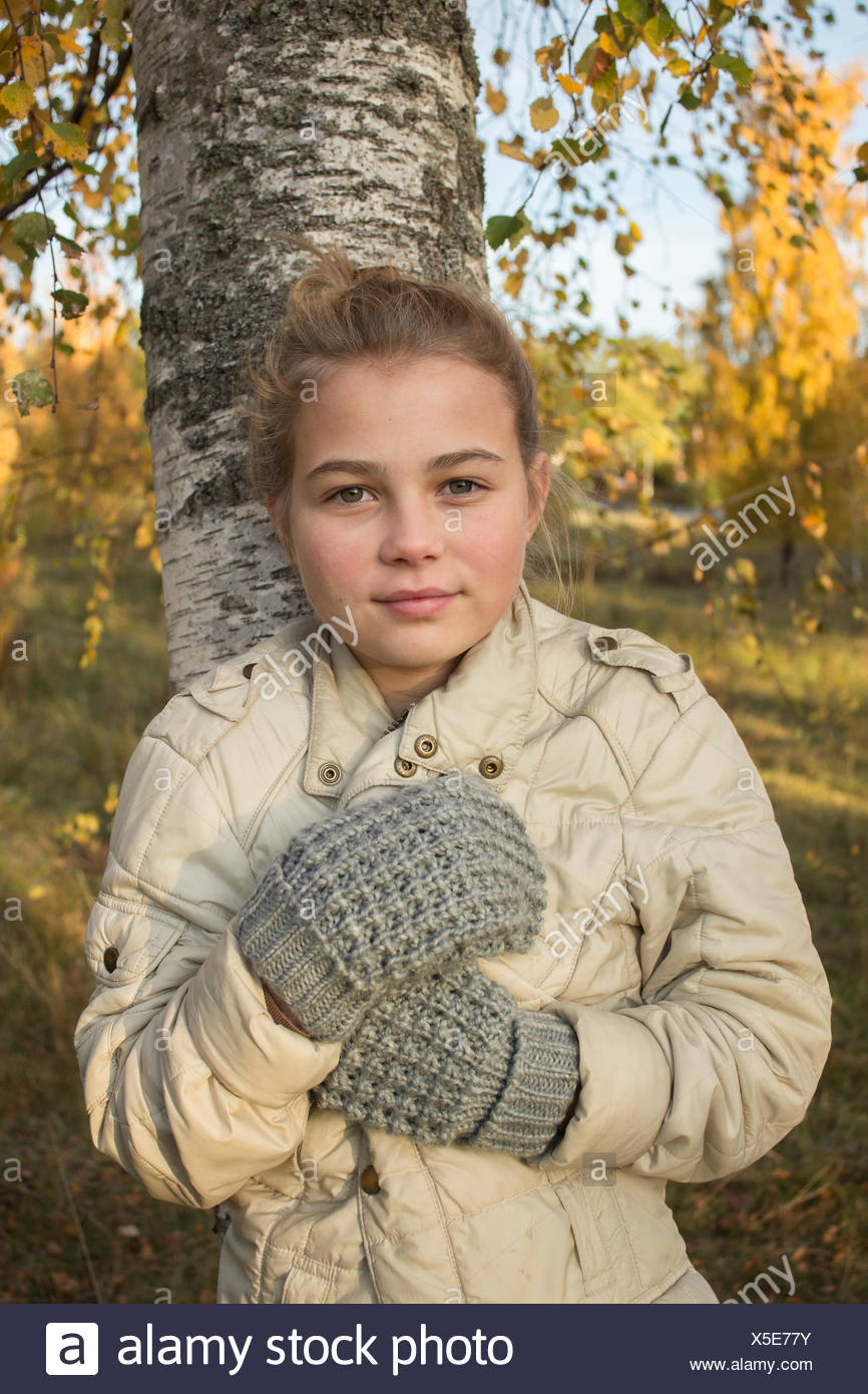 Girl Standing Under Tree Autumn High Resolution Stock Photography and ...