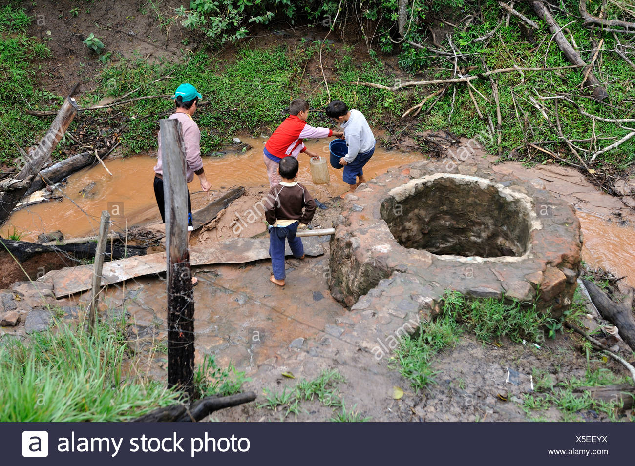 Children Collecting Water From A Well High Resolution Stock Photography ...