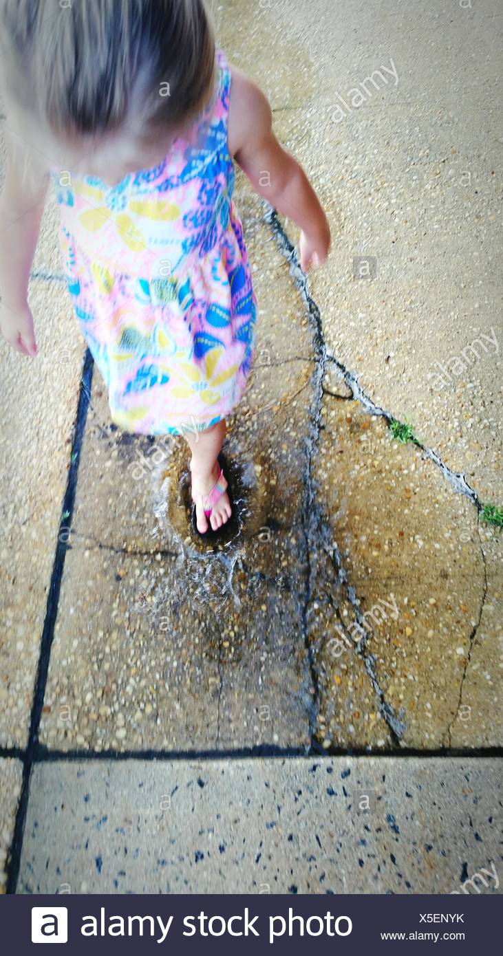 Splashing In Puddle Stock Photos & Splashing In Puddle Stock Images - Alamy