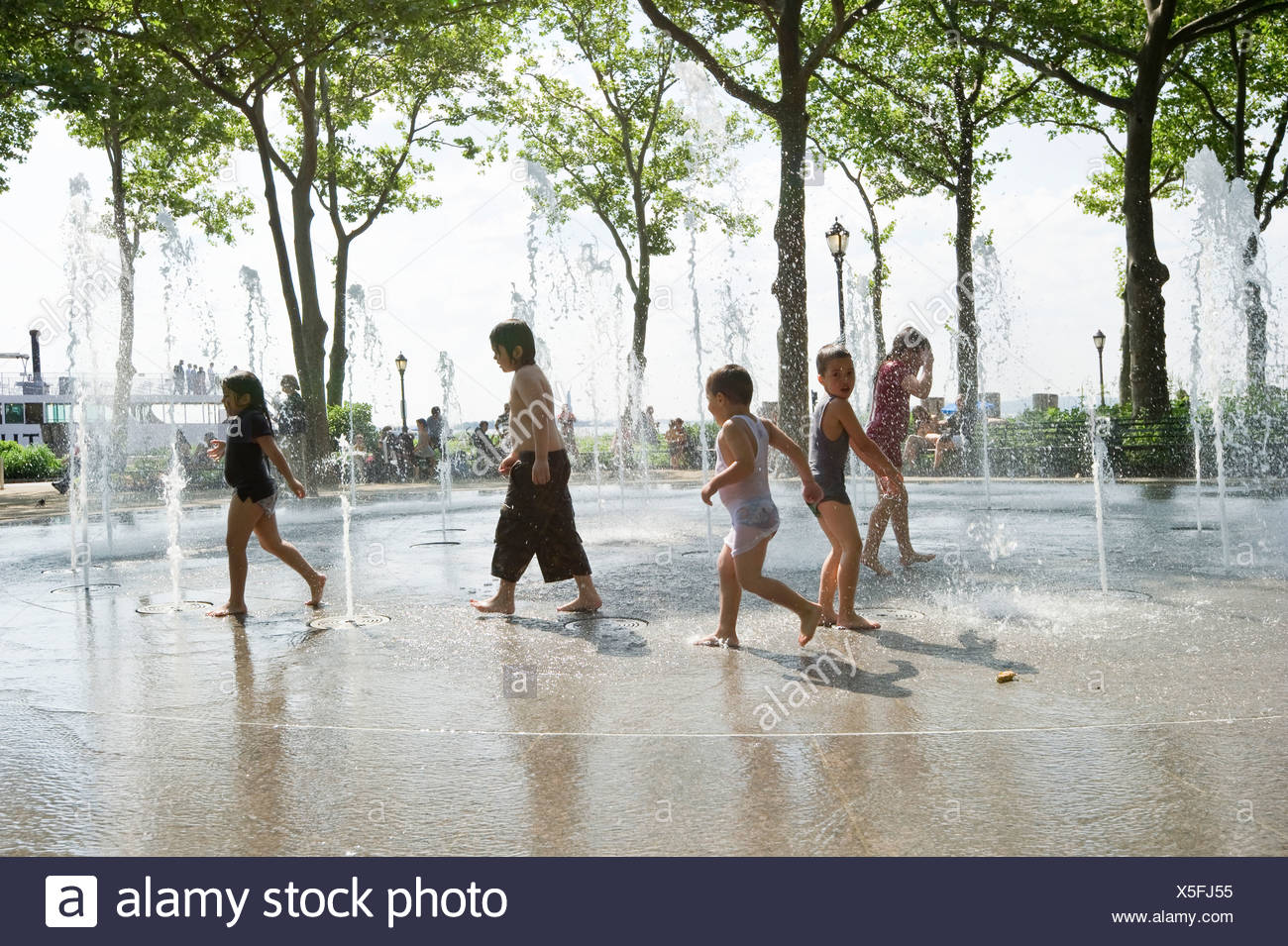 Children Playing In Water Fountain Park High Resolution Stock ...