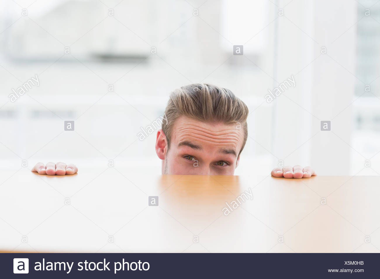 Peeking Over Desk High Resolution Stock Photography and Images - Alamy