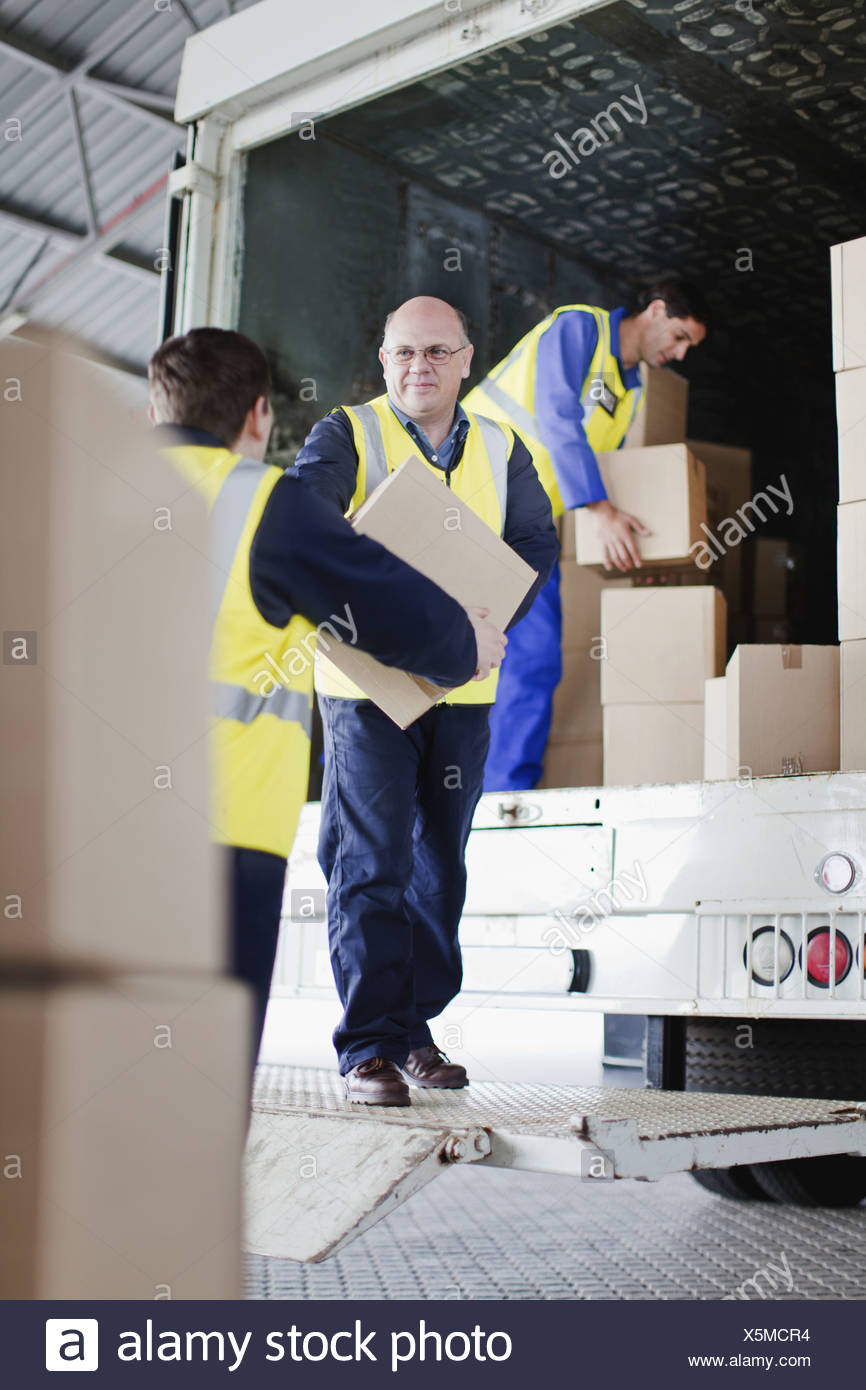 Man Unloading Boxes Warehouse High Resolution Stock Photography and ...