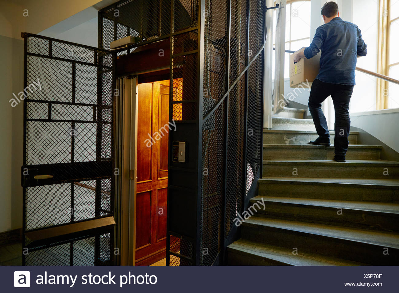 Person Carrying Box Walking High Resolution Stock Photography and ...