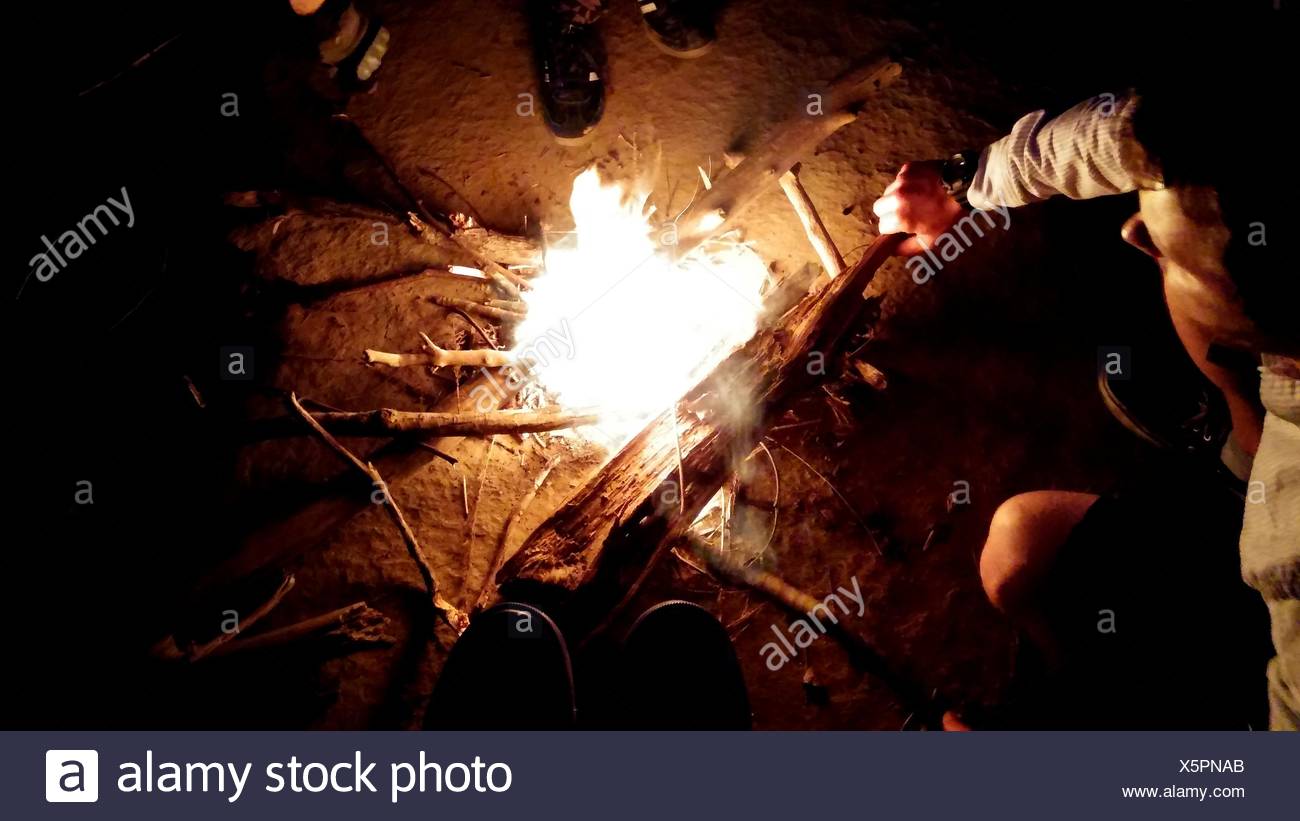 Men Around The Fire At Night High Resolution Stock Photography and ...