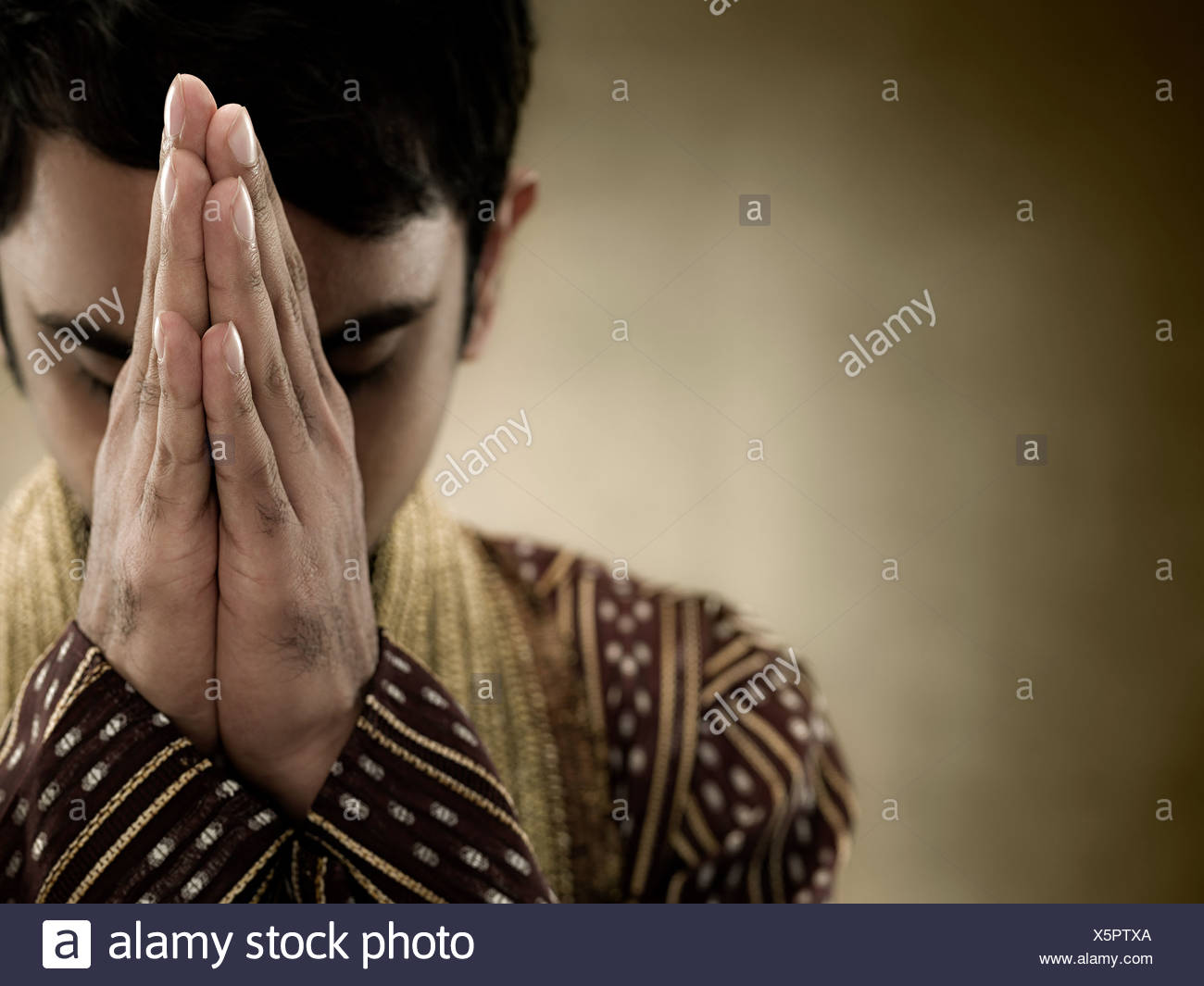Asian Man Praying High Resolution Stock Photography and Images - Alamy
