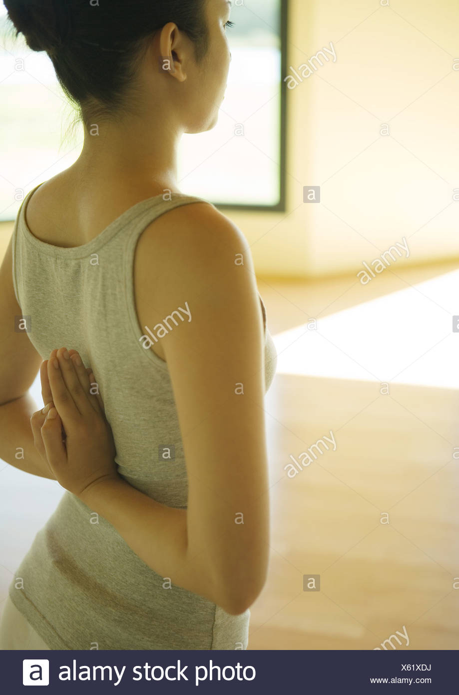 Woman Hands Clasped Behind Back High Resolution Stock Photography and ...