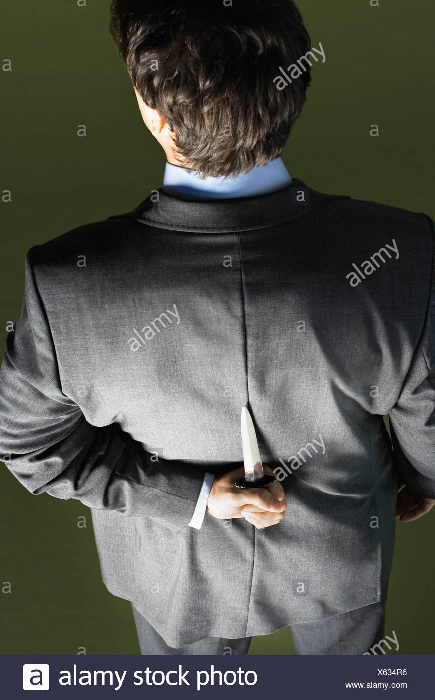 Knife Behind Back Stock Photos & Knife Behind Back Stock Images - Alamy