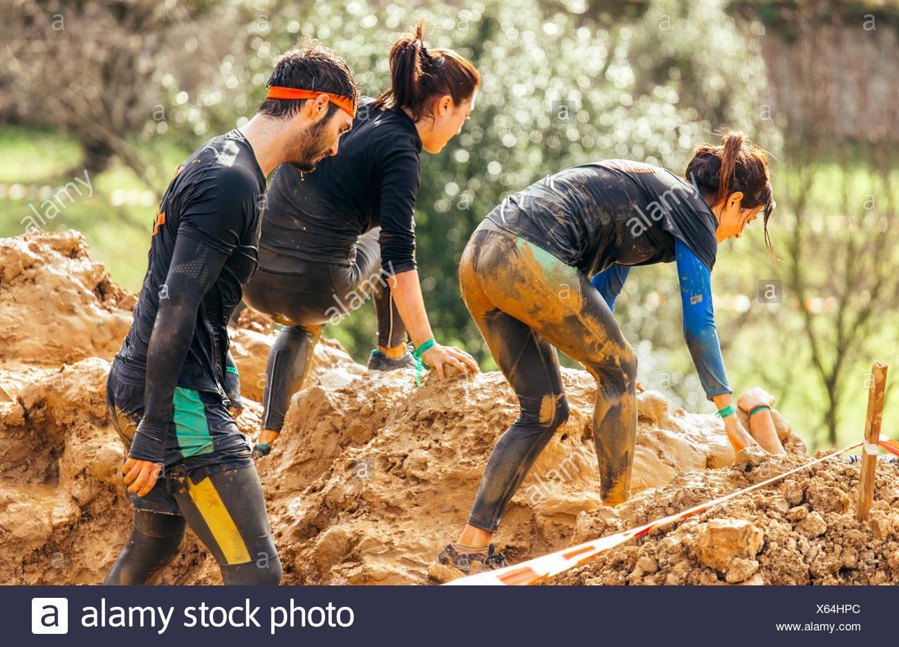 Woman Obstacle Race Mud High Resolution Stock Photography and Images - Alamy