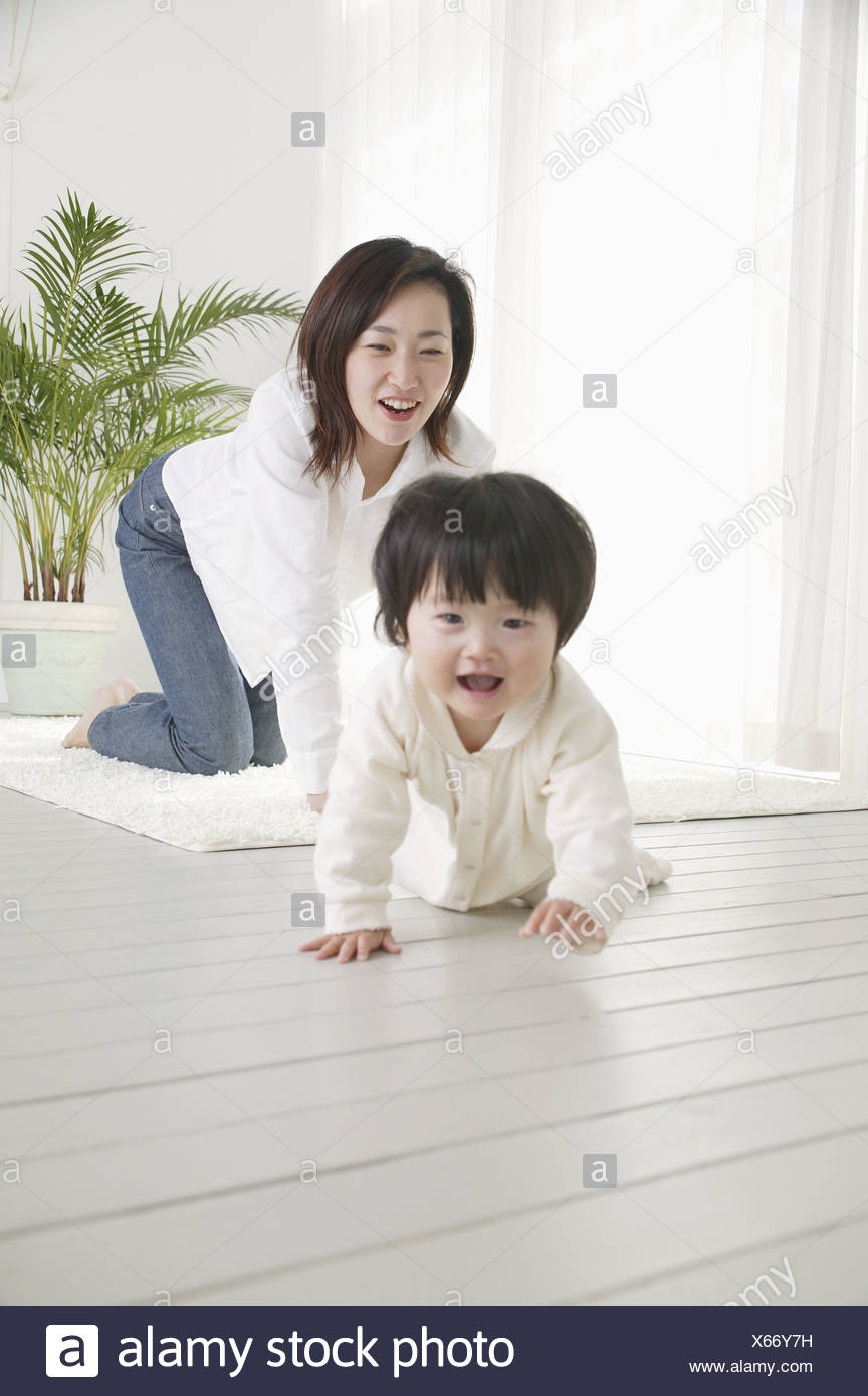 Baby Crawling Mother High Resolution Stock Photography and Images - Alamy