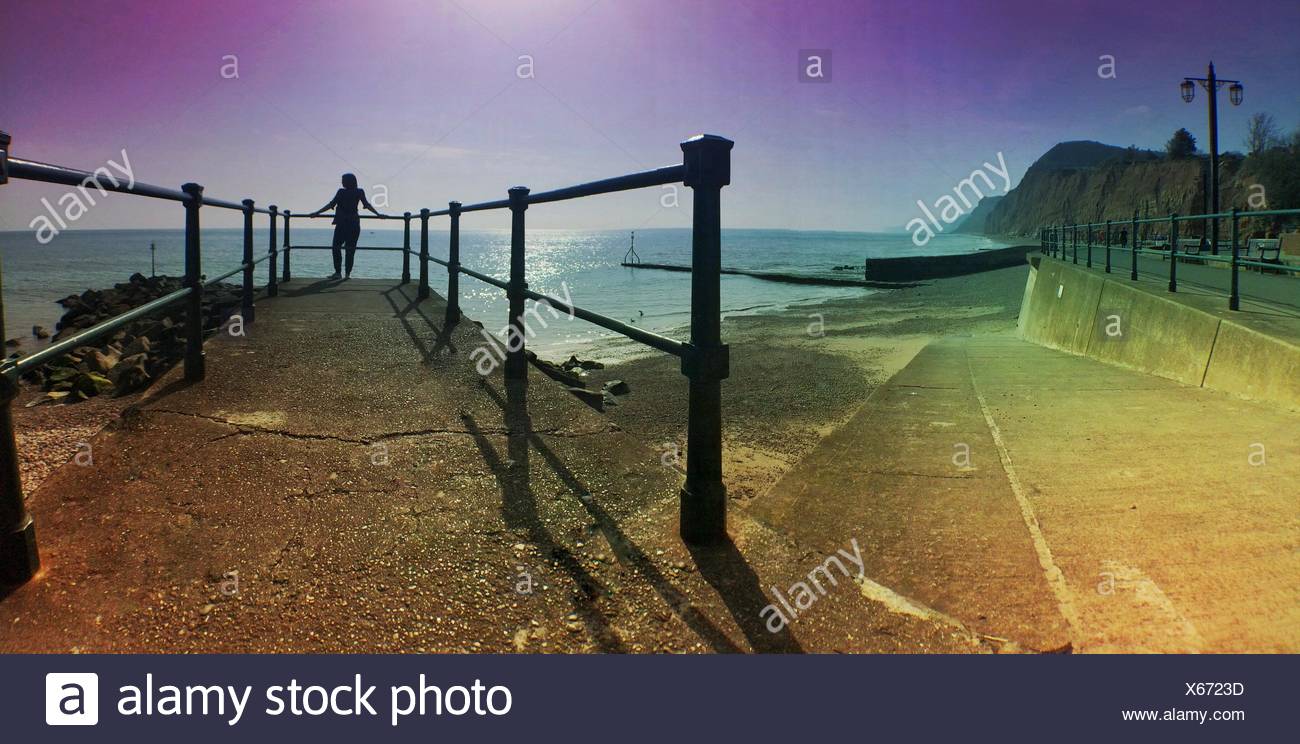 Leaning Against The Railing High Resolution Stock Photography and ...