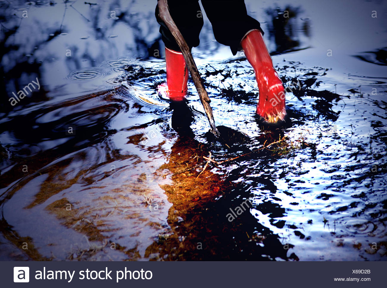 Child Splash Puddles Boots Stock Photos & Child Splash Puddles Boots ...