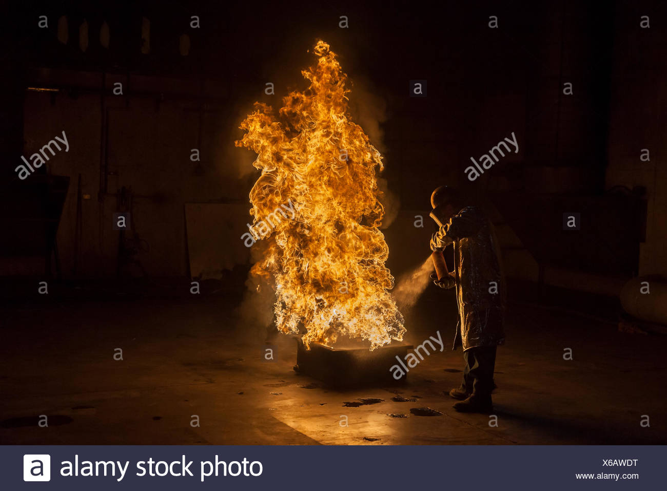 Firefighter Fire Extinguisher High Resolution Stock Photography and ...