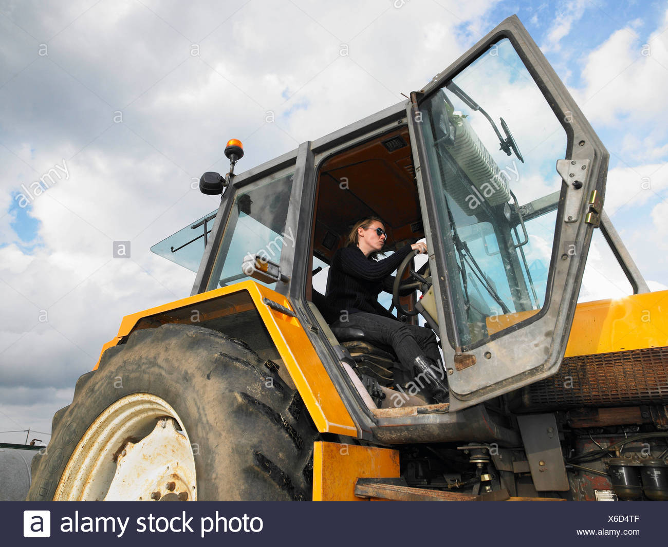 Woman Driving Tractor High Resolution Stock Photography and Images - Alamy