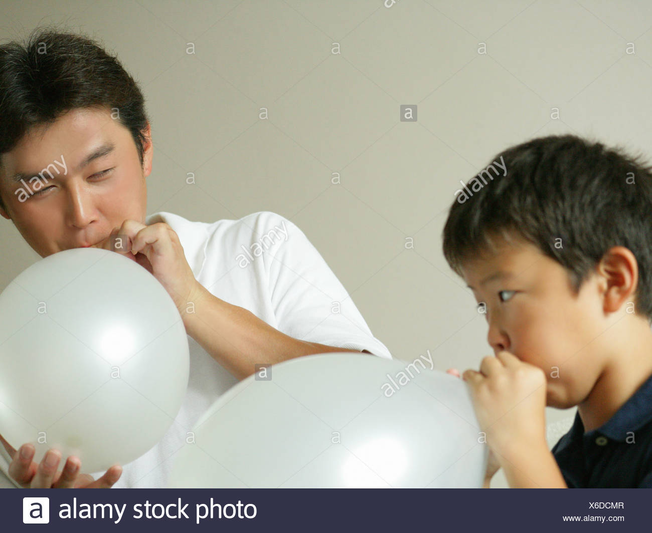 Man Blowing Up Balloons High Resolution Stock Photography and Images ...