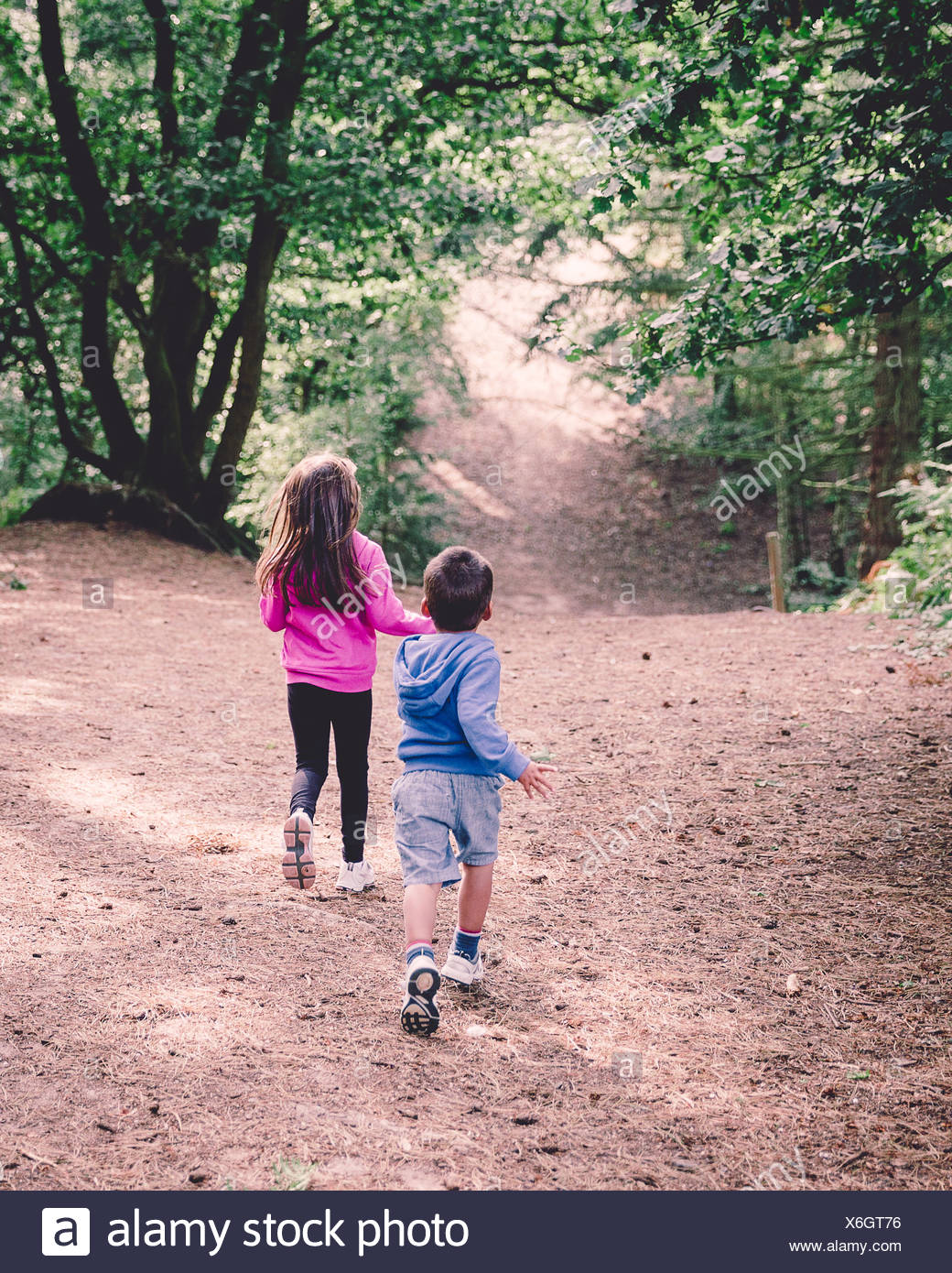 Two Boys Running In Forest High Resolution Stock Photography and Images ...