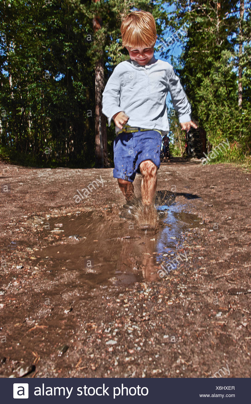 Boy In Puddle High Resolution Stock Photography and Images - Alamy
