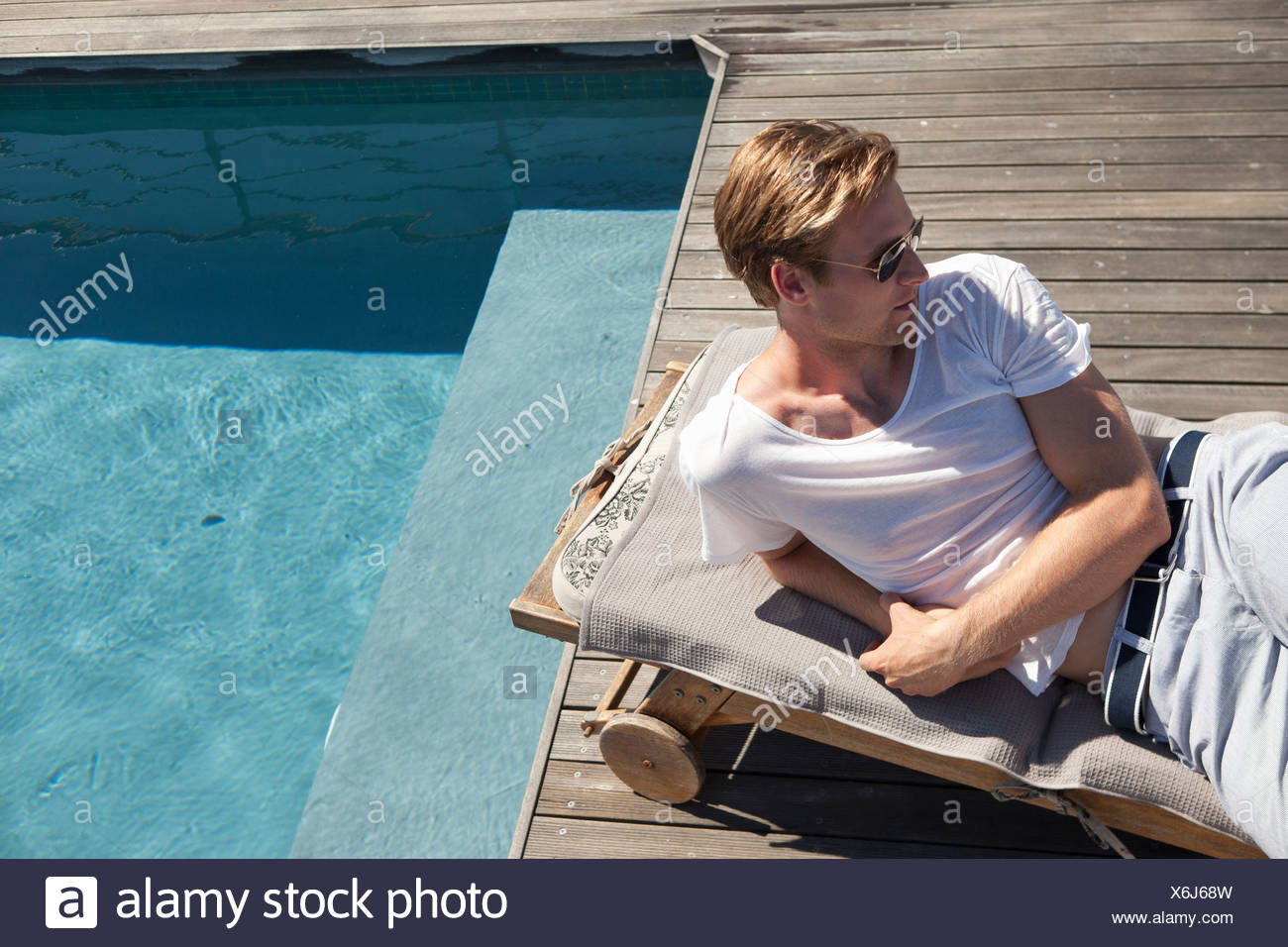 Person Laying By The Pool Stock Photos & Person Laying By The Pool ...