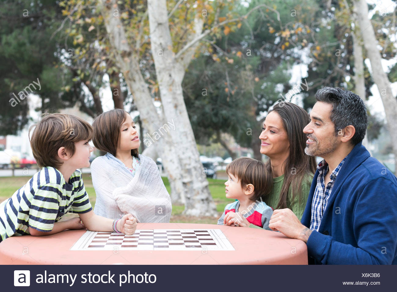Children Sitting Around Table Stock Photos & Children Sitting Around ...