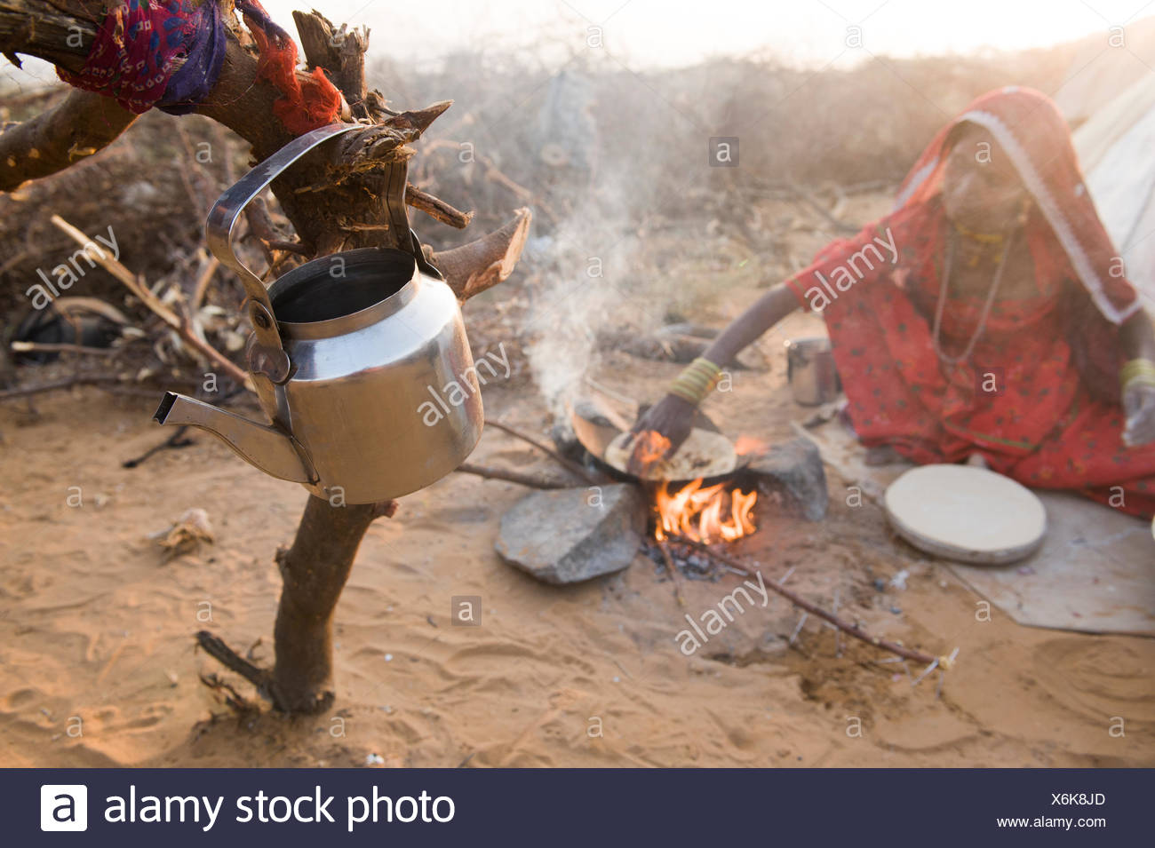 Woman Cooking Over Open Fire Stock Photos & Woman Cooking Over Open ...