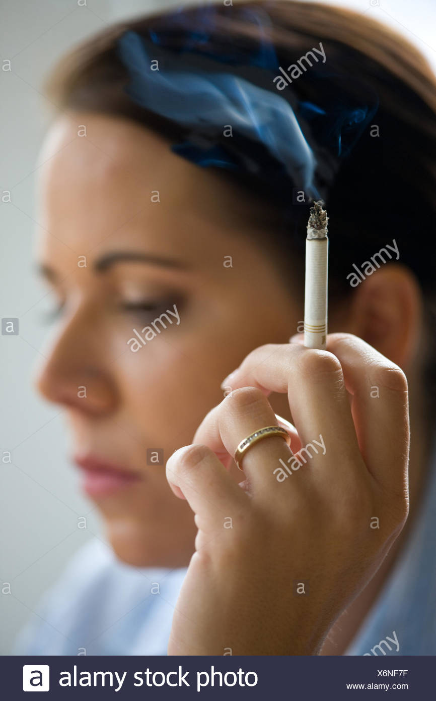 Woman Chain Smoking High Resolution Stock Photography and Images - Alamy