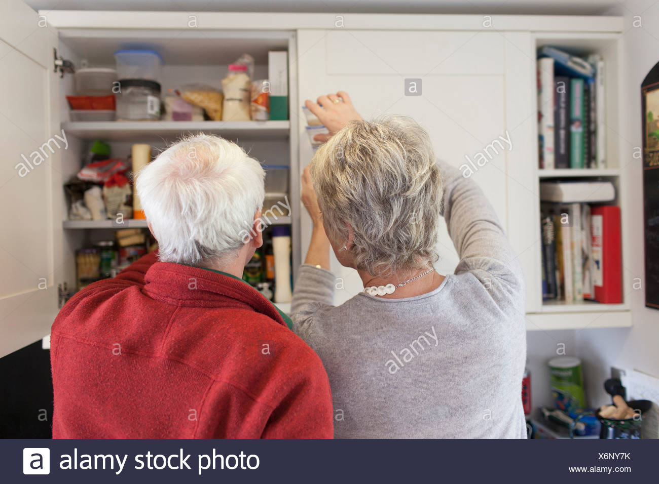 Reaching Into Cupboard High Resolution Stock Photography and Images - Alamy