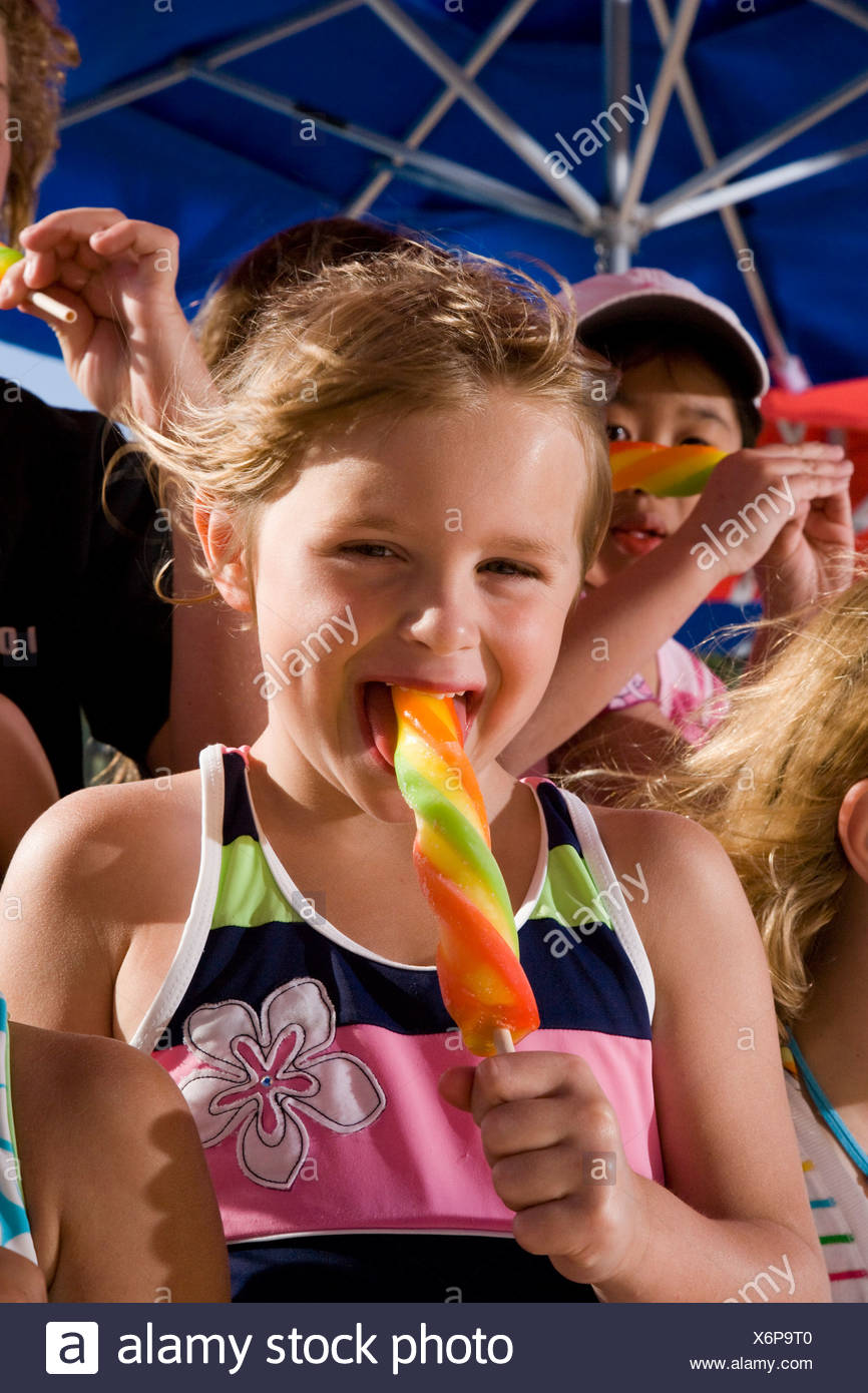 Girl Licking Popsicle High Resolution Stock Photography and Images - Alamy