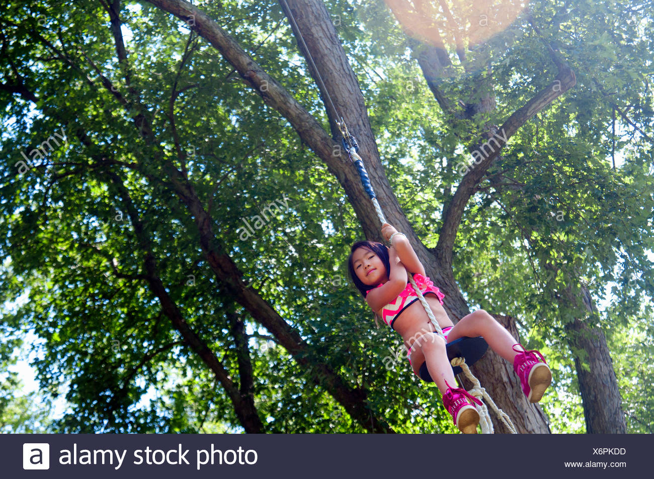 Girl On Swing Rope High Resolution Stock Photography and Images - Alamy