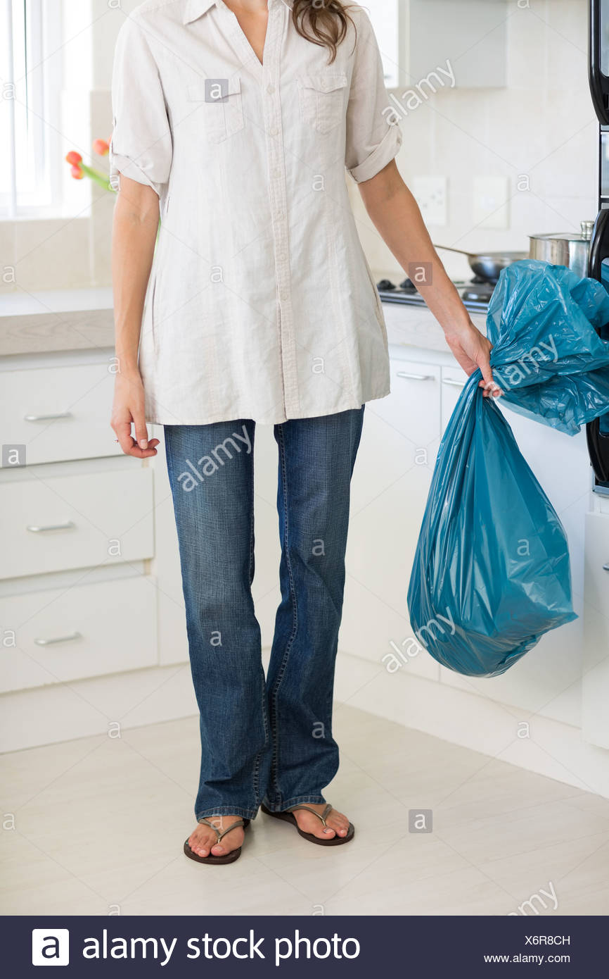 Woman Carrying Garbage Bag High Resolution Stock Photography and Images ...