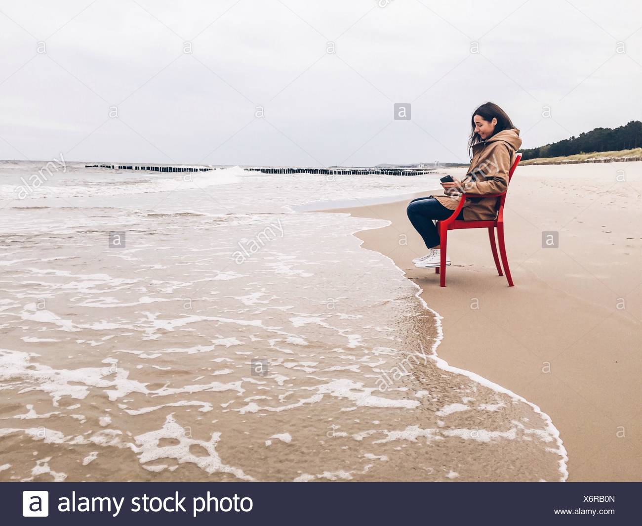 Woman Sitting In Beach Chair High Resolution Stock Photography and ...